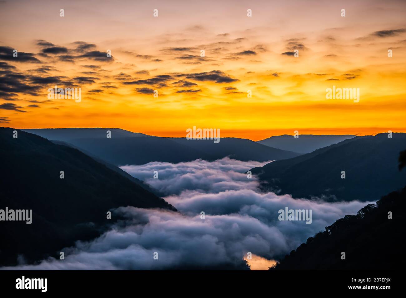 Mountains landscape clouds foggy mist in morning above new river gorge ...