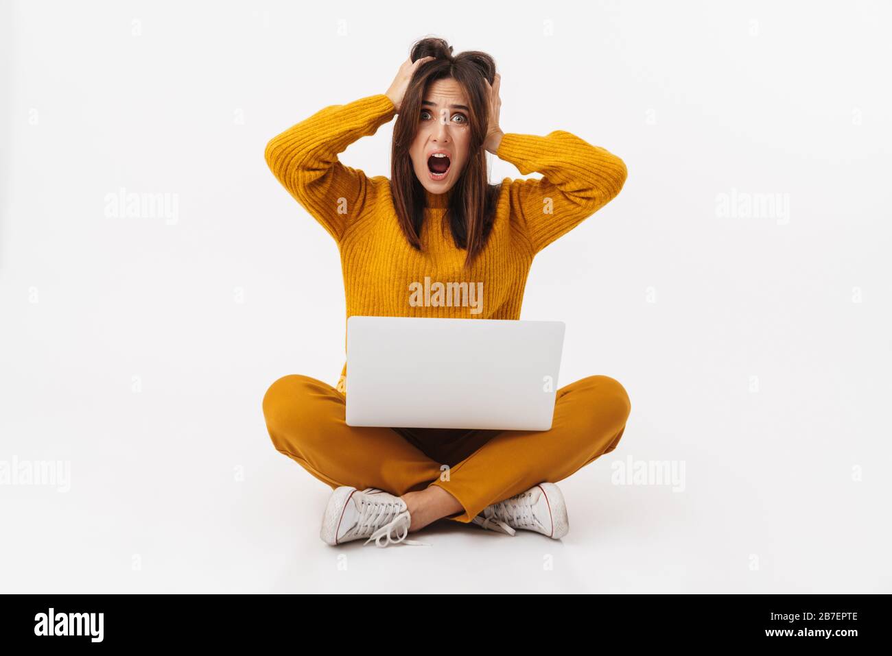 Image of beautiful brunette adult woman grabbing head and holding ...