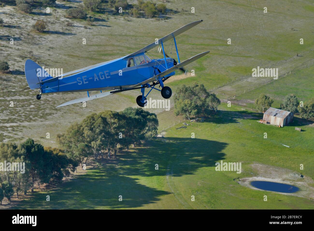 An aerial view of a Swedish registered De Havilland DH.87 Hornet Moth ...