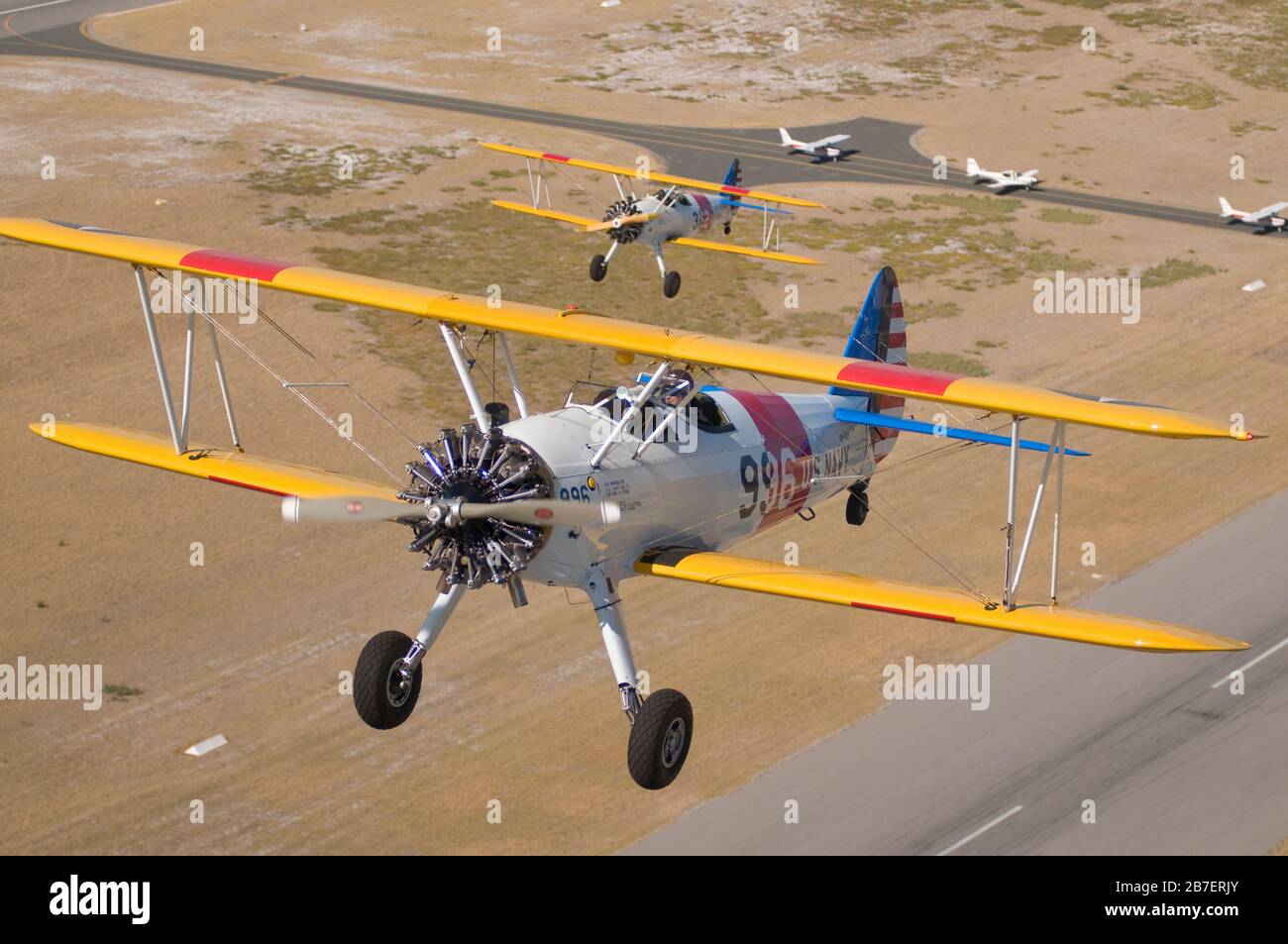 Aerial shot of two WWII Boeing Stearman biplane pilot trainers taking ...