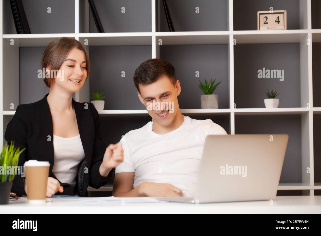 Loving couple working successfully together on their own business in ...