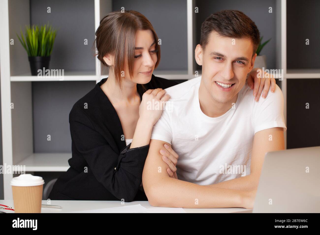 Loving couple working successfully together on their own business in ...