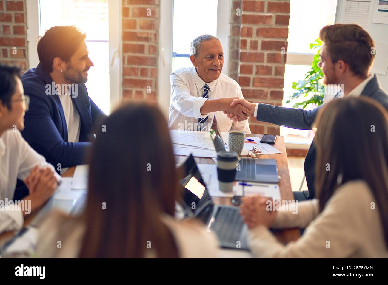 Group of business workers smiling happy and confident. Working together ...