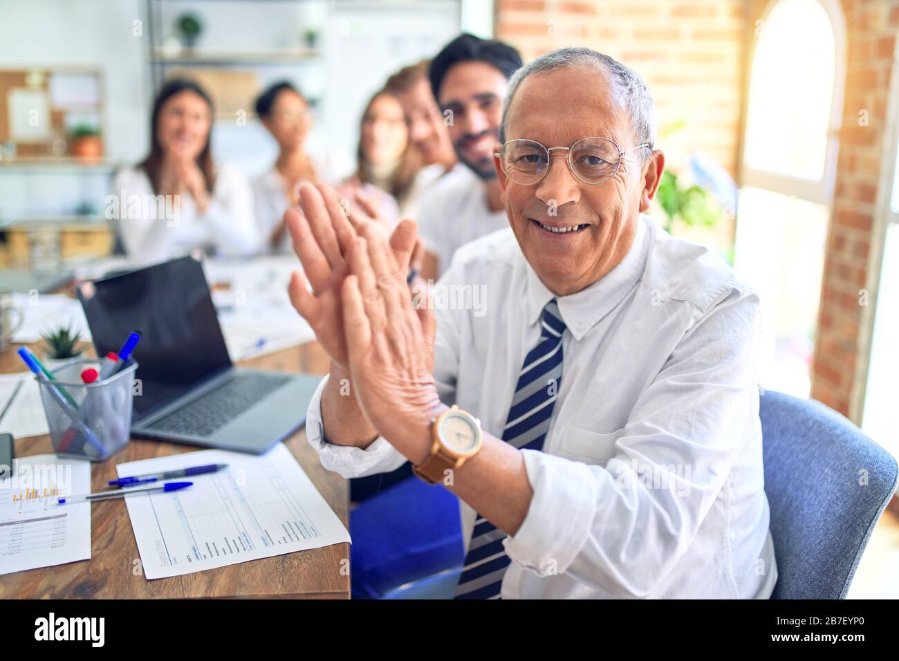 Group of business workers smiling happy and confident. Working together ...