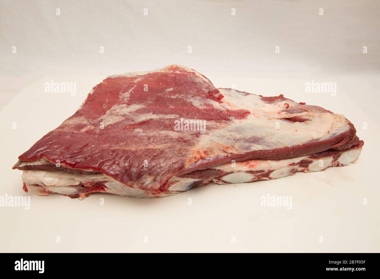 Raw meat on board Stock Photo - Alamy
