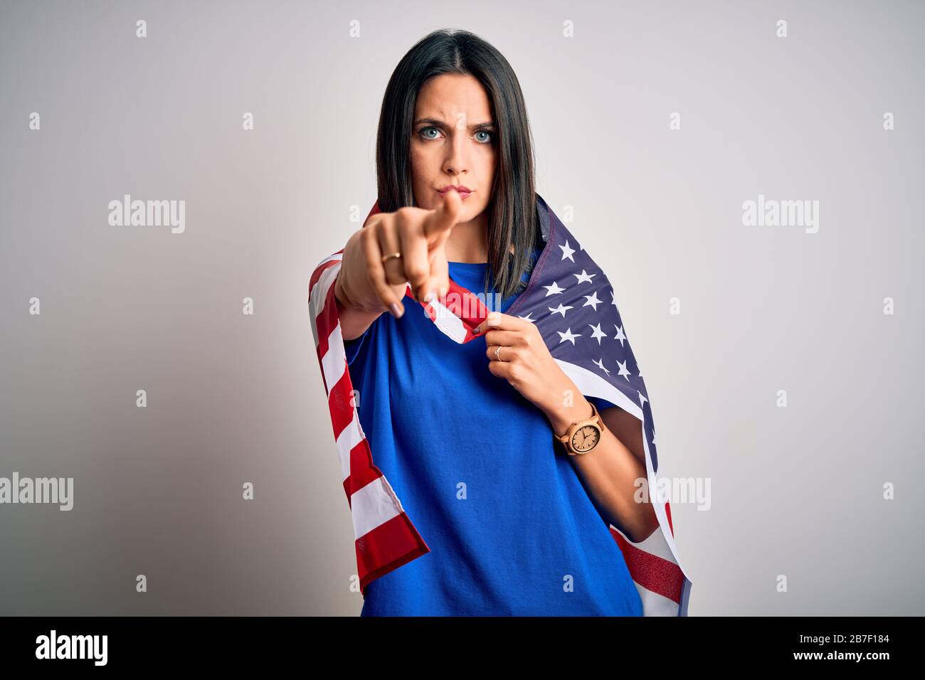 Young brunette patriotic woman with blue eyes wearing united states of ...