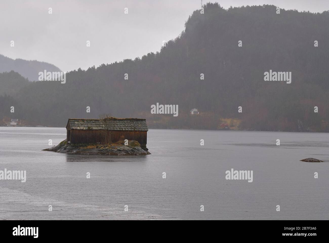 A boathouse on a tiny little rock-island in the Samnangerfjord Stock ...