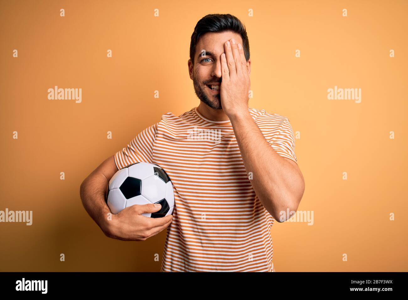 One portrait yellow half football hi-res stock photography and images ...