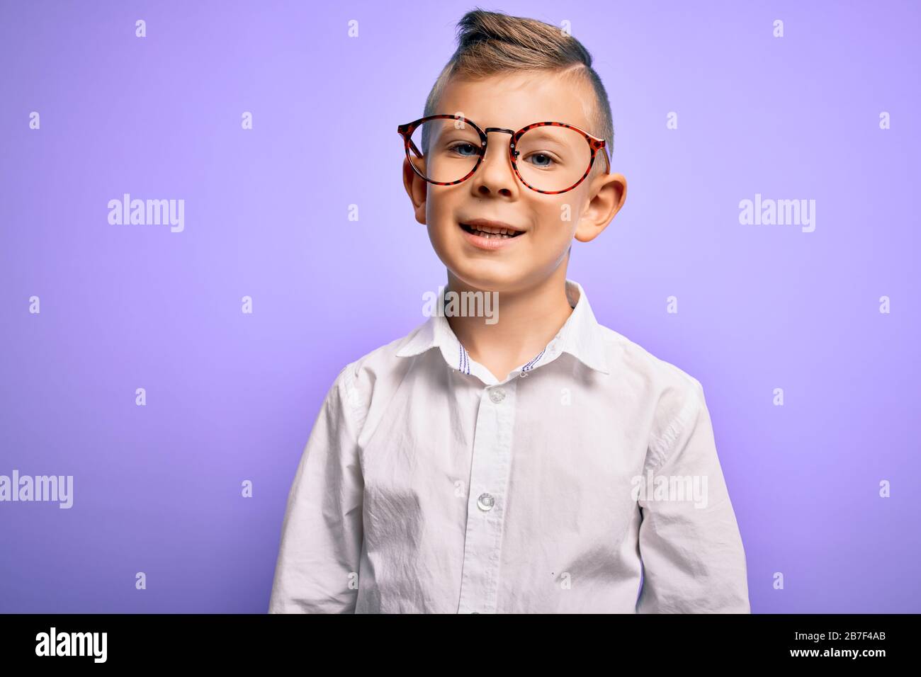 Young little caucasian kid with blue eyes wearing glasses and white ...