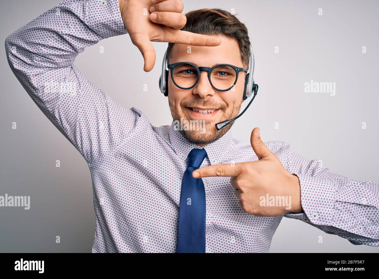 Young call center operator business man with blue eyes wearing glasses ...