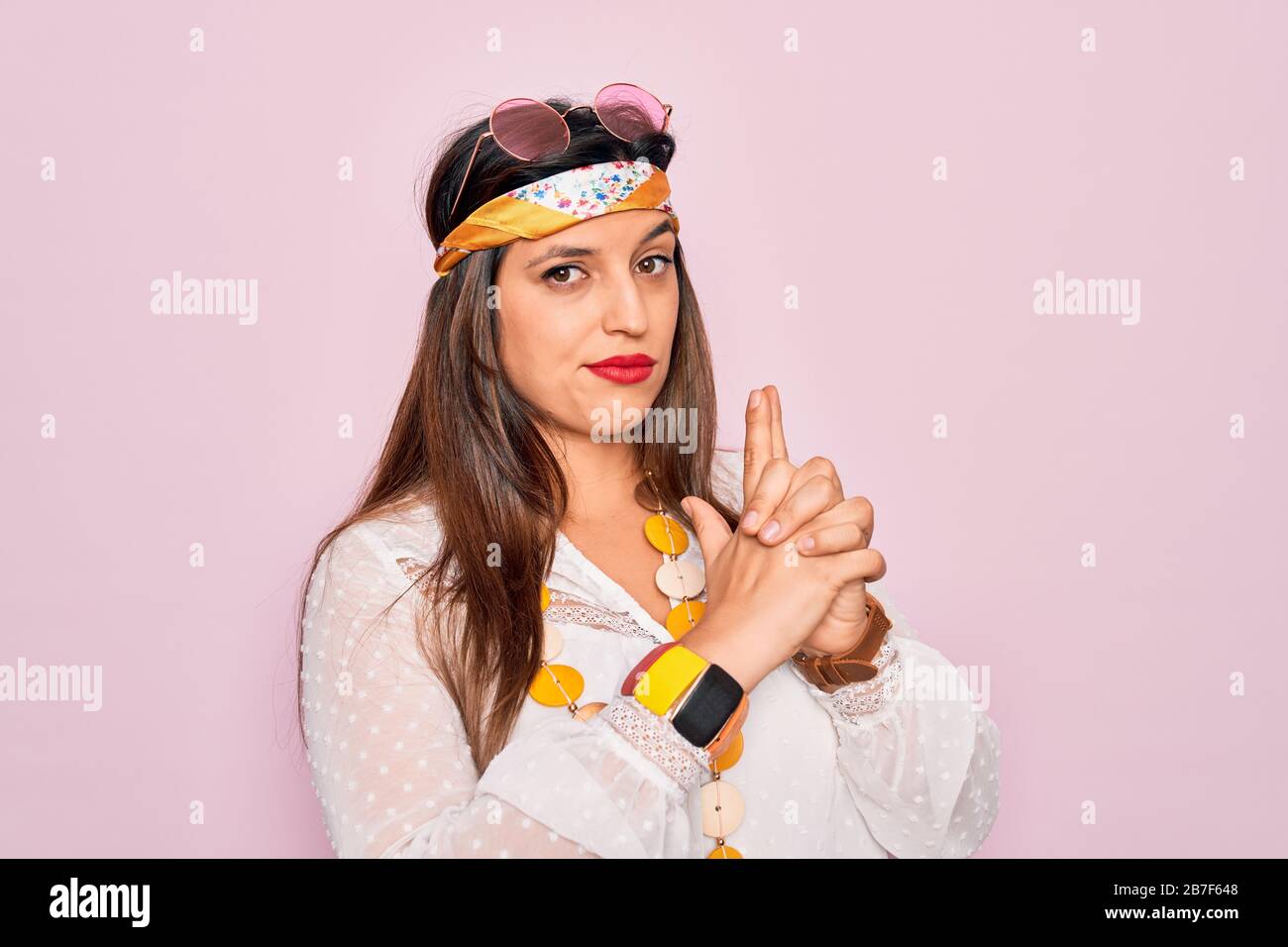 Young hispanic hippie woman wearing fashion boho style and sunglasses ...