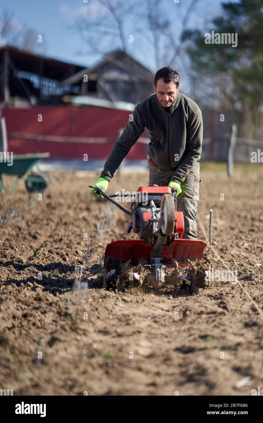Farmer weeding motorized tiller hi-res stock photography and images - Alamy