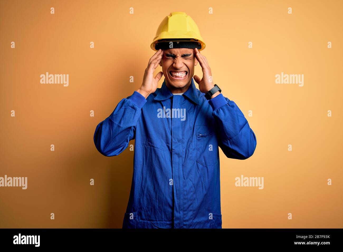 Young handsome african american worker man wearing blue uniform and ...