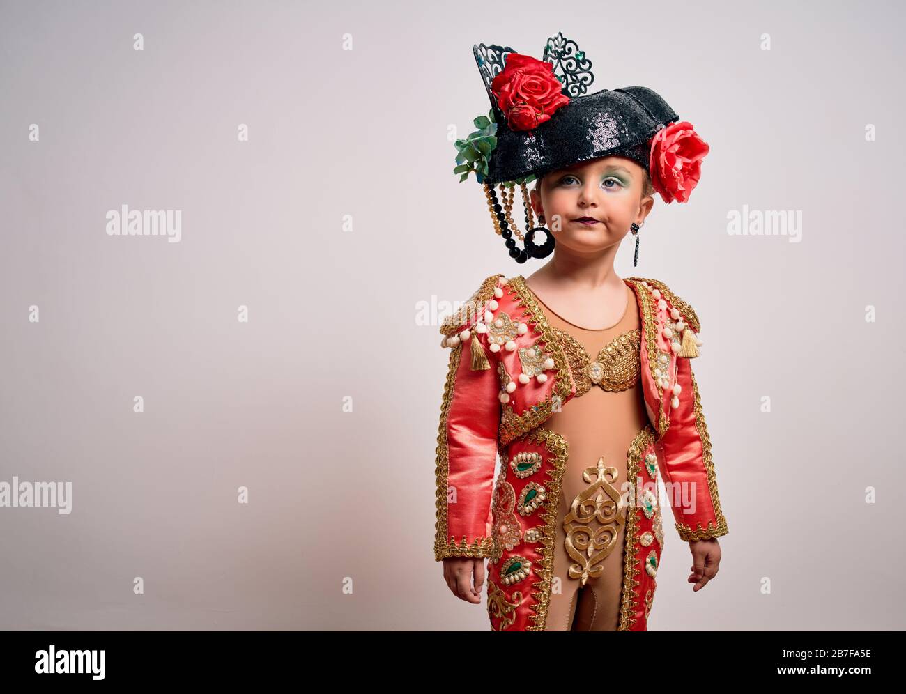 Young little caucasian kid girl wearing bullfighter traditional folkore ...