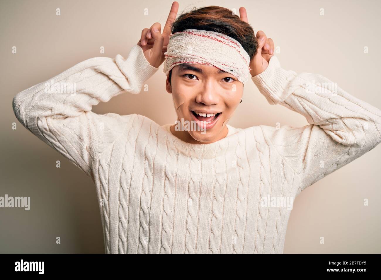 Young handsome chinese man injured for accident wearing bandage and ...