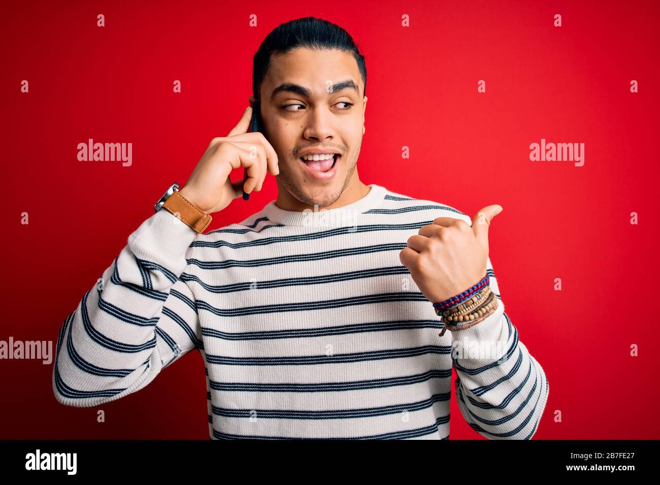 Brazilian man having conversation talking on the smartphone over ...