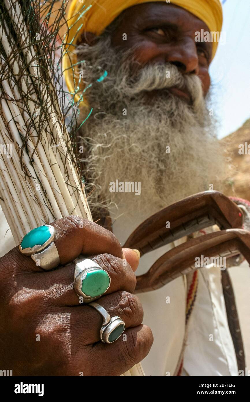 Jaisalmer, Rajasthan, India: an old Indian man shows his three rings in ...