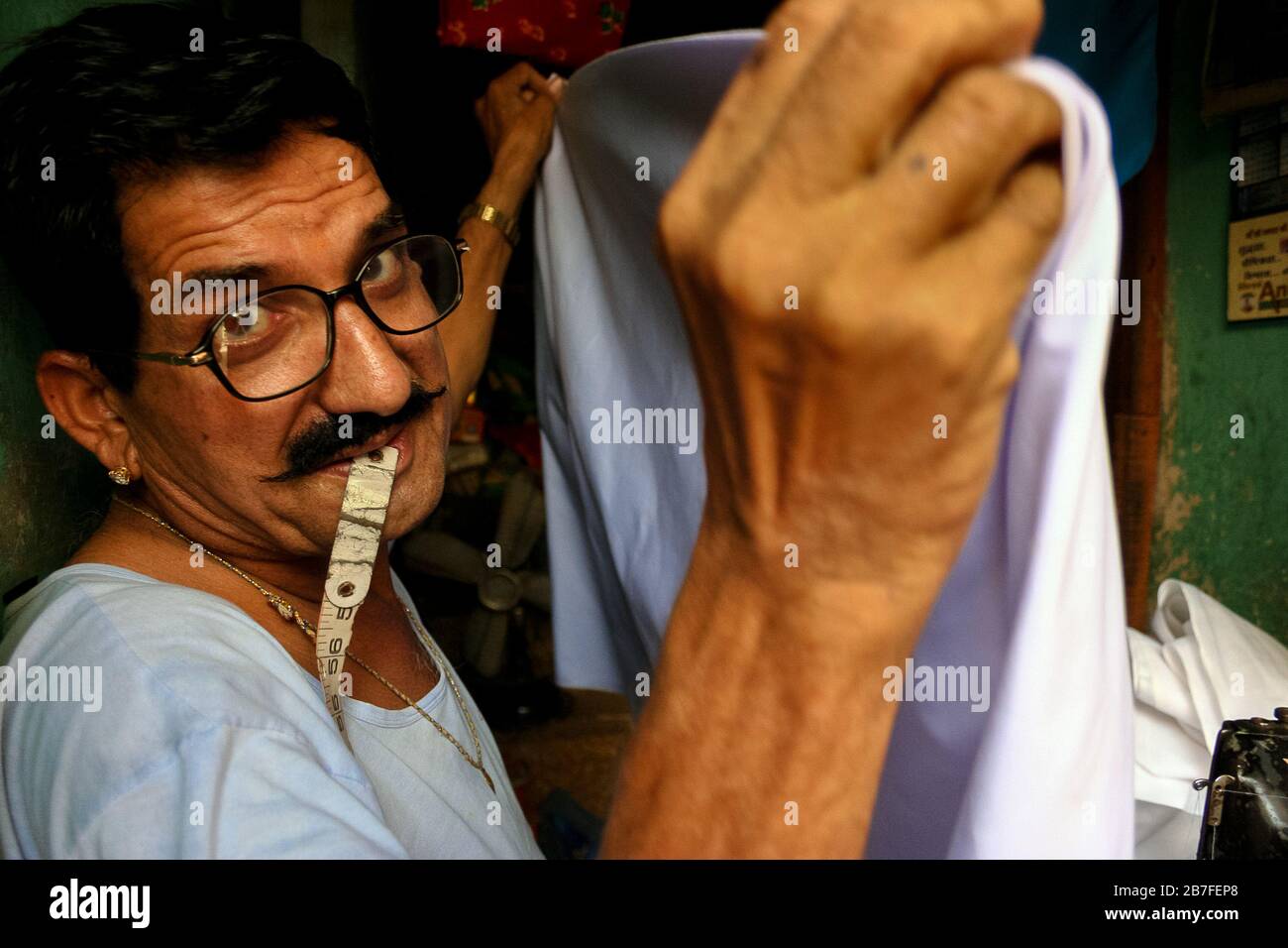 Jaisalmer, Rajasthan, India: an Indian tailor working in his small ...