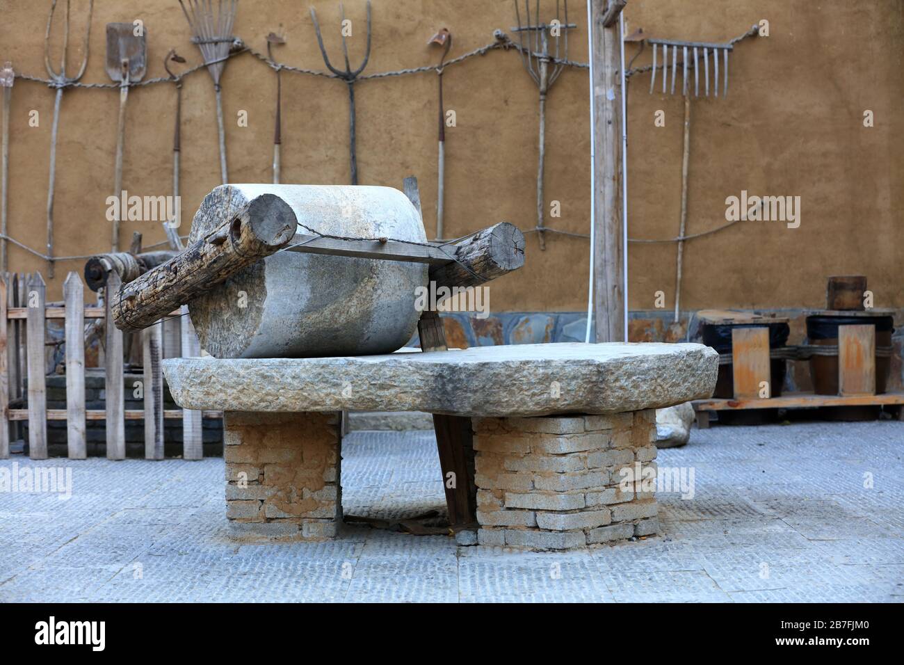 A close-up of the ancient Chinese stone mill Stock Photo - Alamy