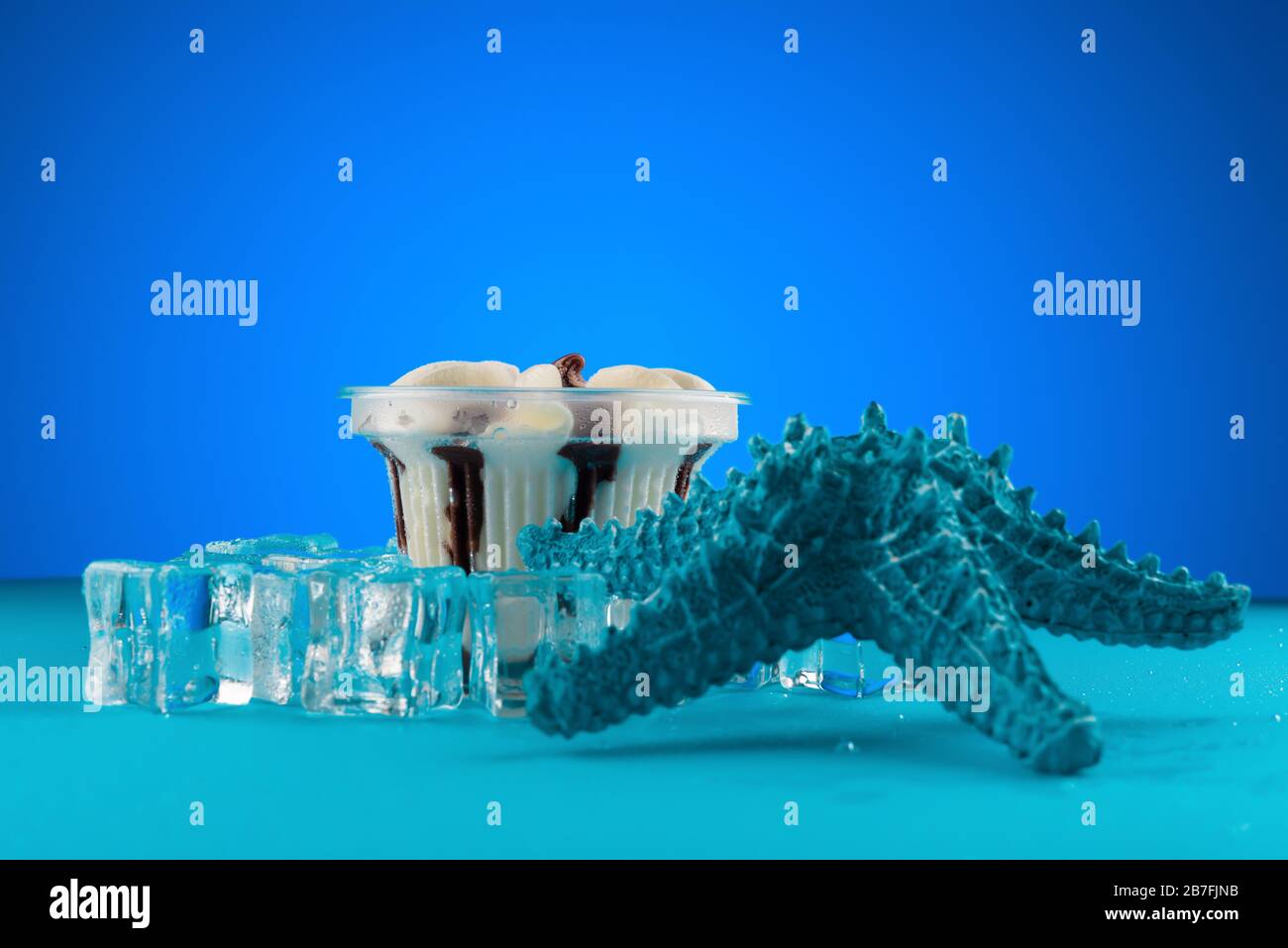 ice cream cone and blue starfish and ice cubes Stock Photo - Alamy