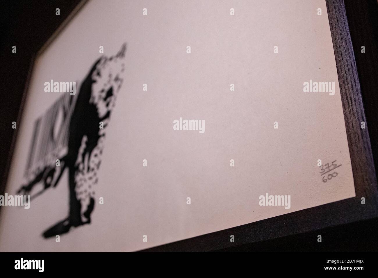 Artworks by British artist Banksy are seen during a press preview of ...