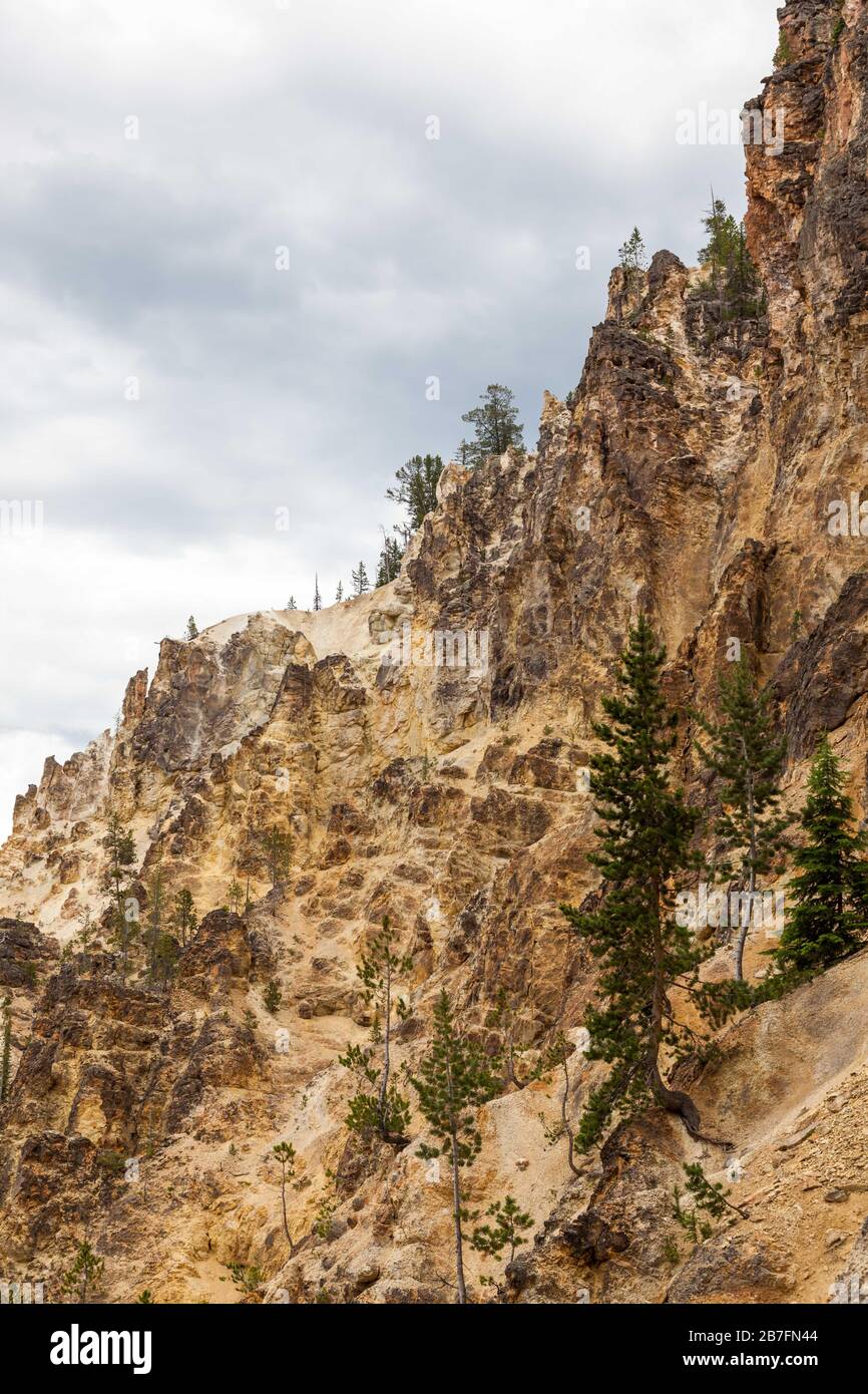 Steep rock walls that have been eroded over time and topped with ...