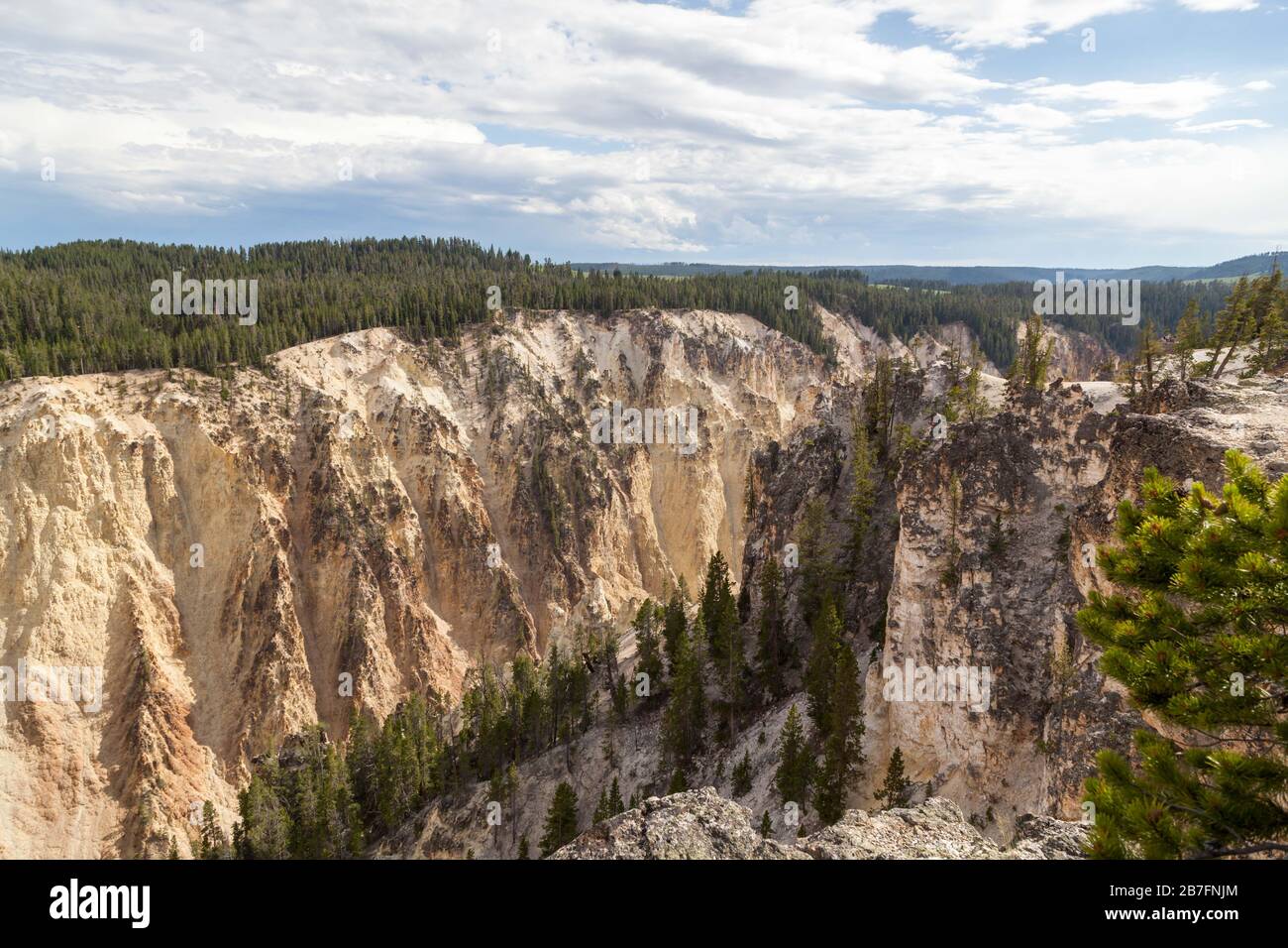 Steep rock walls that have been eroded over time and topped with ...
