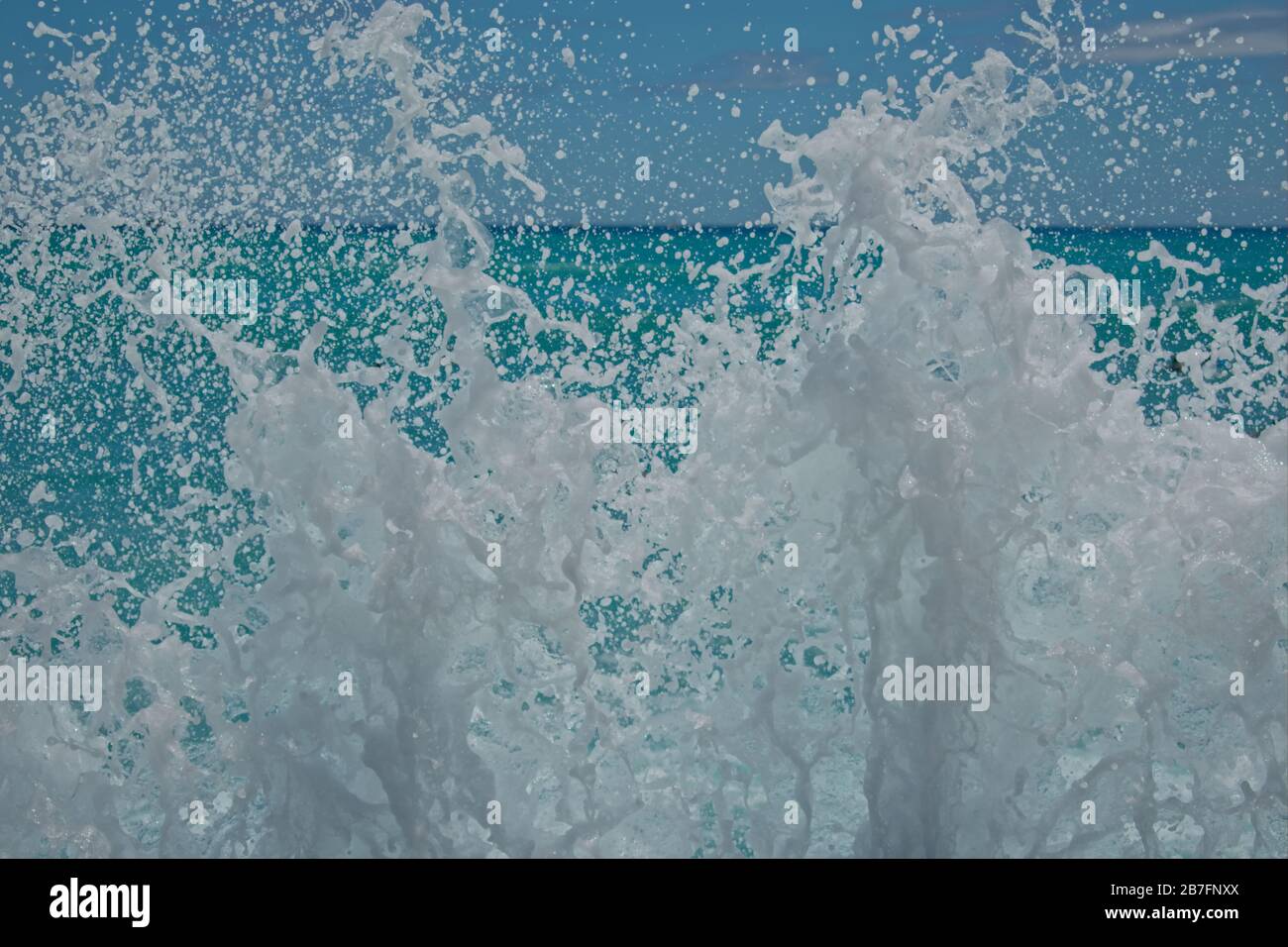 Ocean wave splash Stock Photo - Alamy