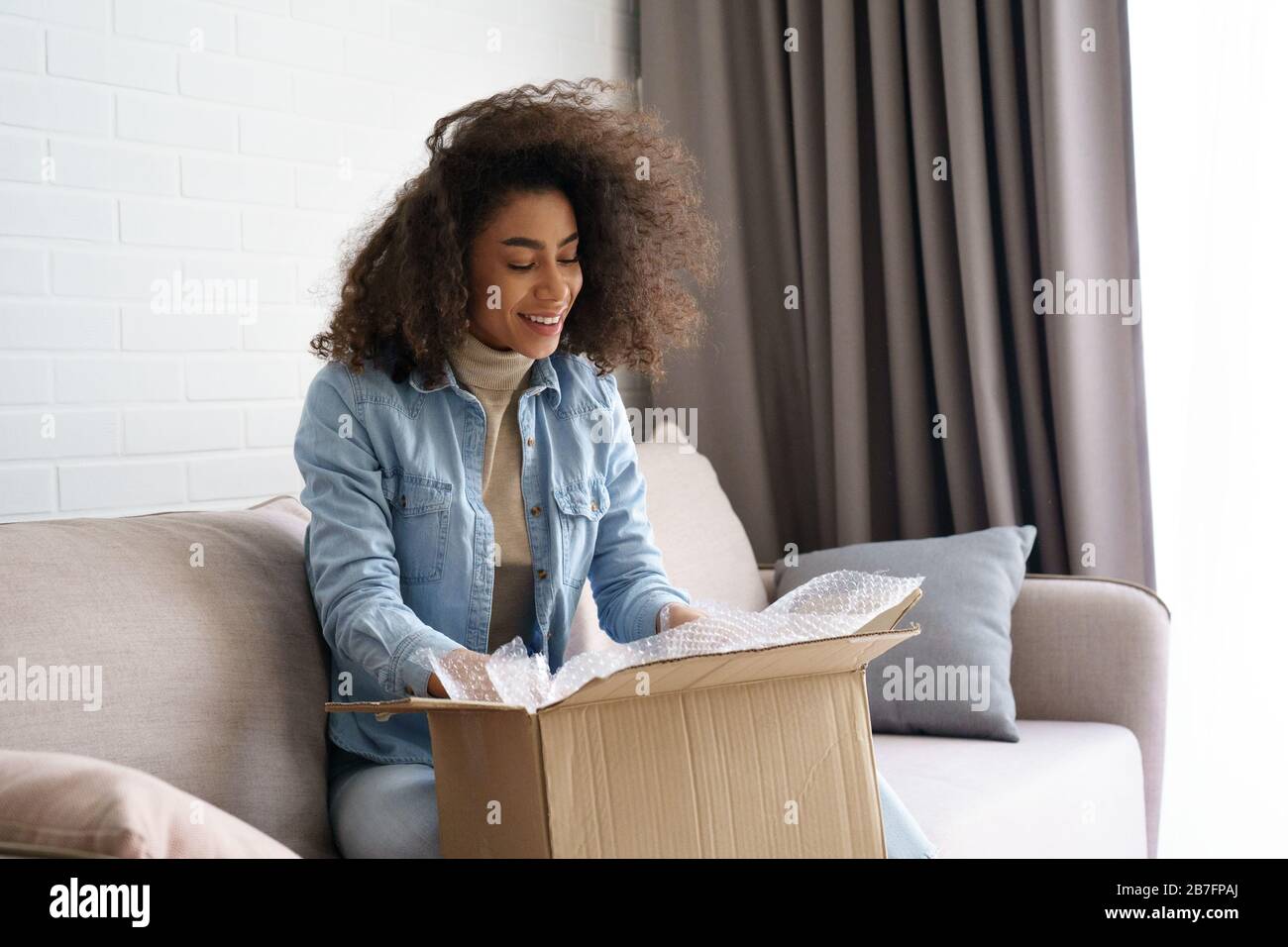 Happy person opening box hi-res stock photography and images - Alamy