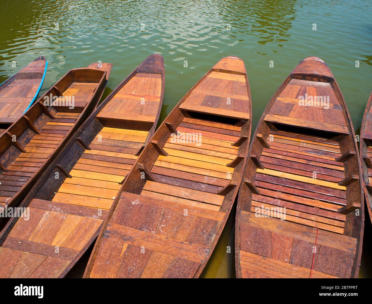 Wooden boat float in lake Stock Photo - Alamy