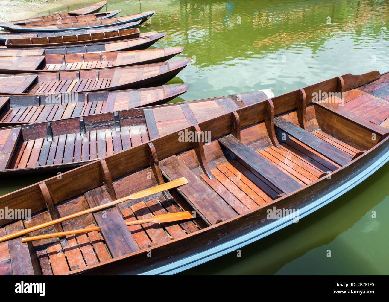 Wooden boat float in lake Stock Photo - Alamy