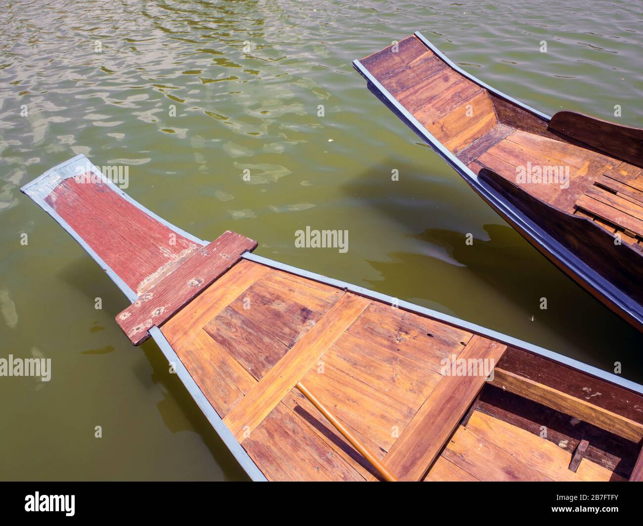 Wooden boat float in lake Stock Photo - Alamy