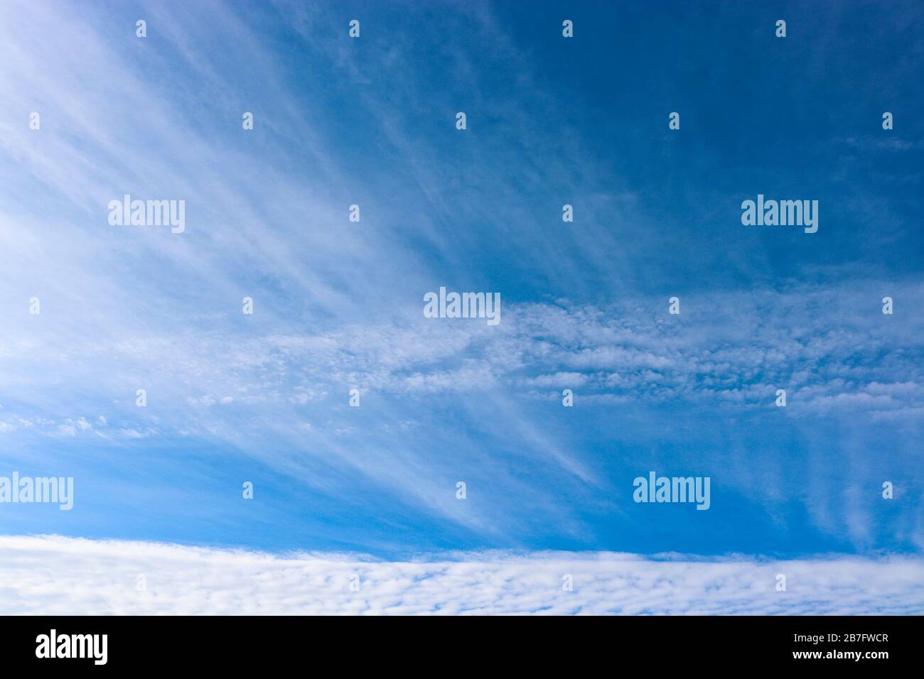 Cirrus and Cirrocumulus clouds against the blue sky. Natural background ...