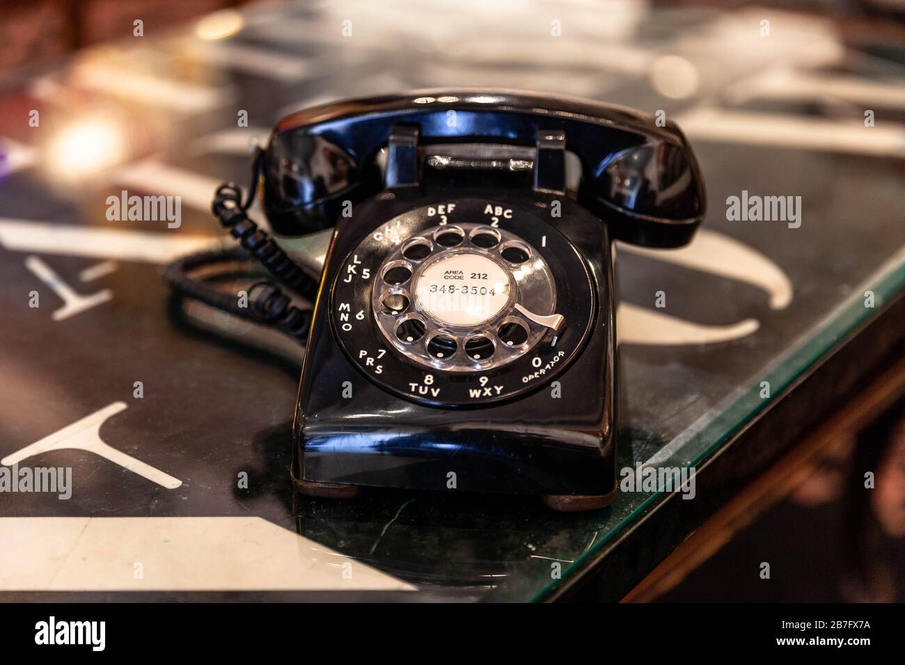 A long shot of an old rotary dial telephone sitting on a desktop Stock ...
