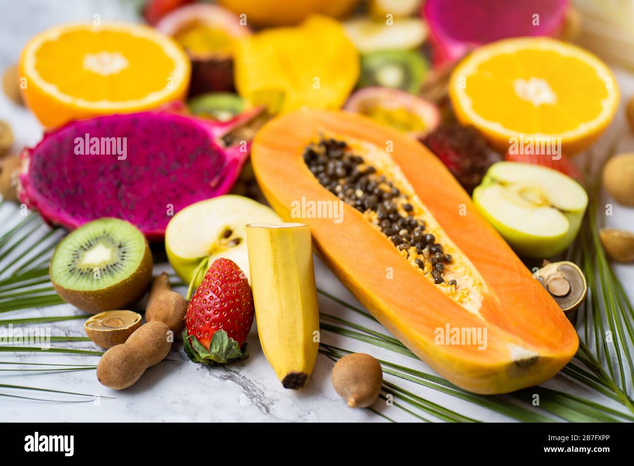 Set of sliced exotic fresh fruits. Assorted ripe juicy tropical summer ...