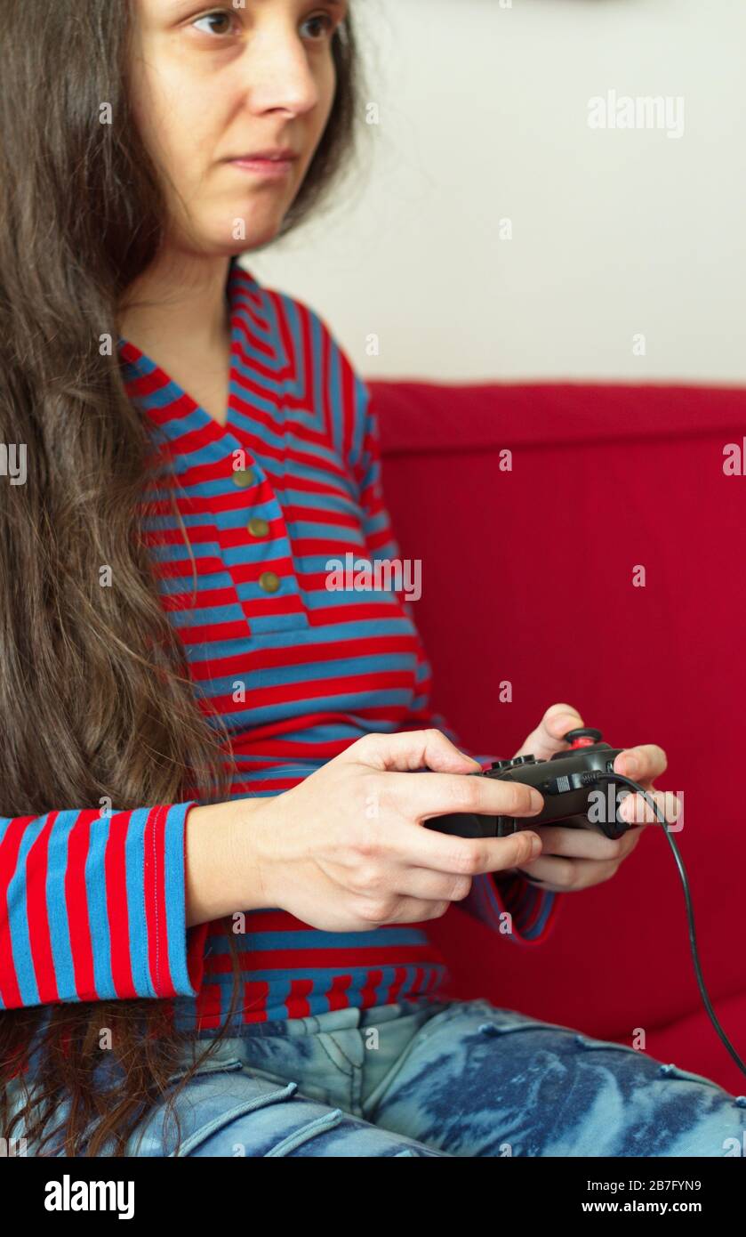 Young woman playing computer game hi-res stock photography and images ...
