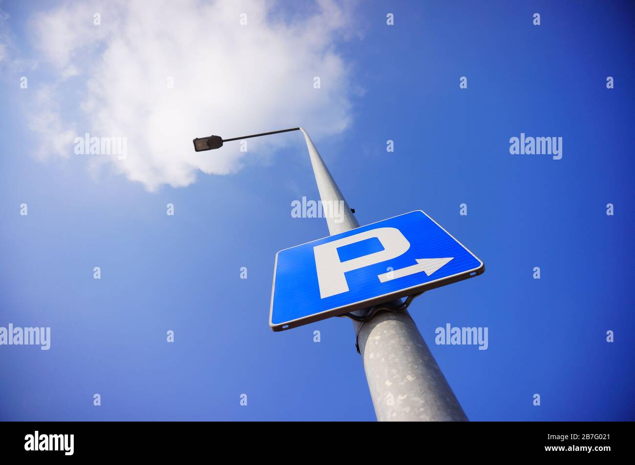 Street sign showing the direction to the parking Stock Photo - Alamy