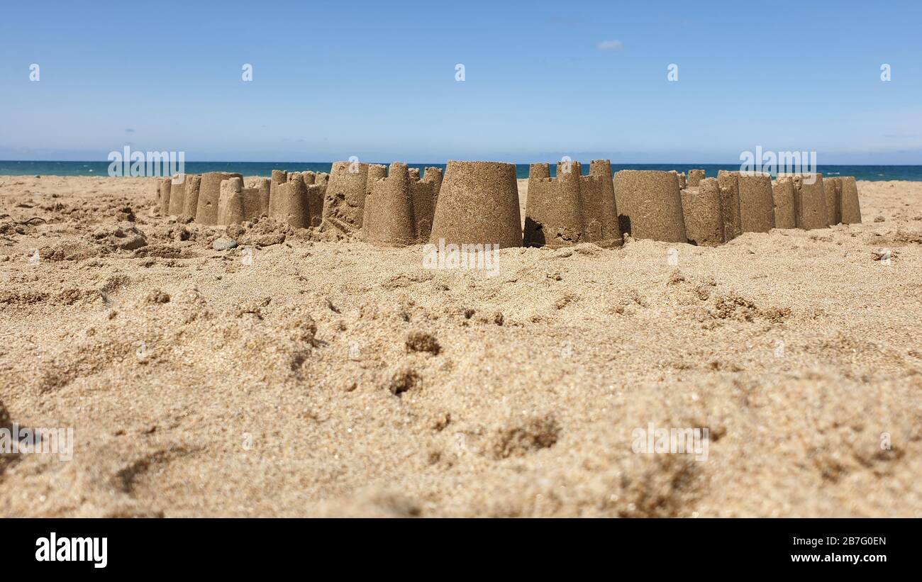 Beautiful shot of figures made out of the sand on the beach Stock Photo ...