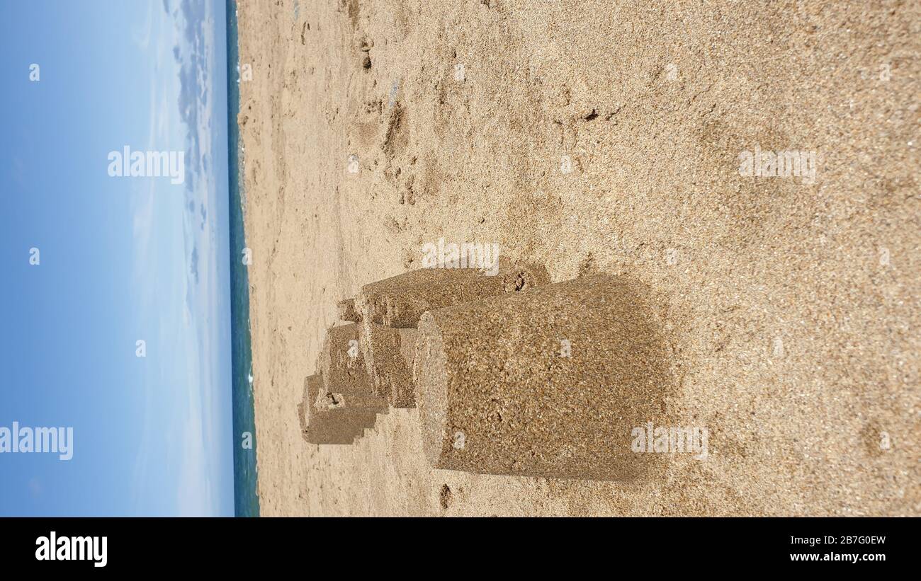 Beautiful shot of figures made out of the sand on the beach Stock Photo ...