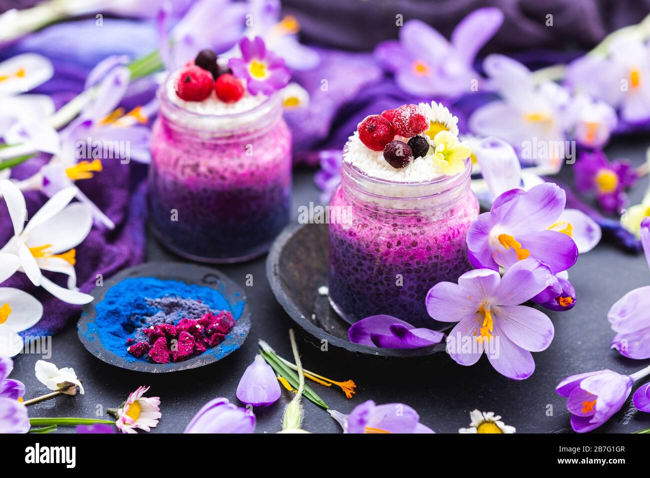 Beautiful display of purple spring vegan smoothies adorned with ...