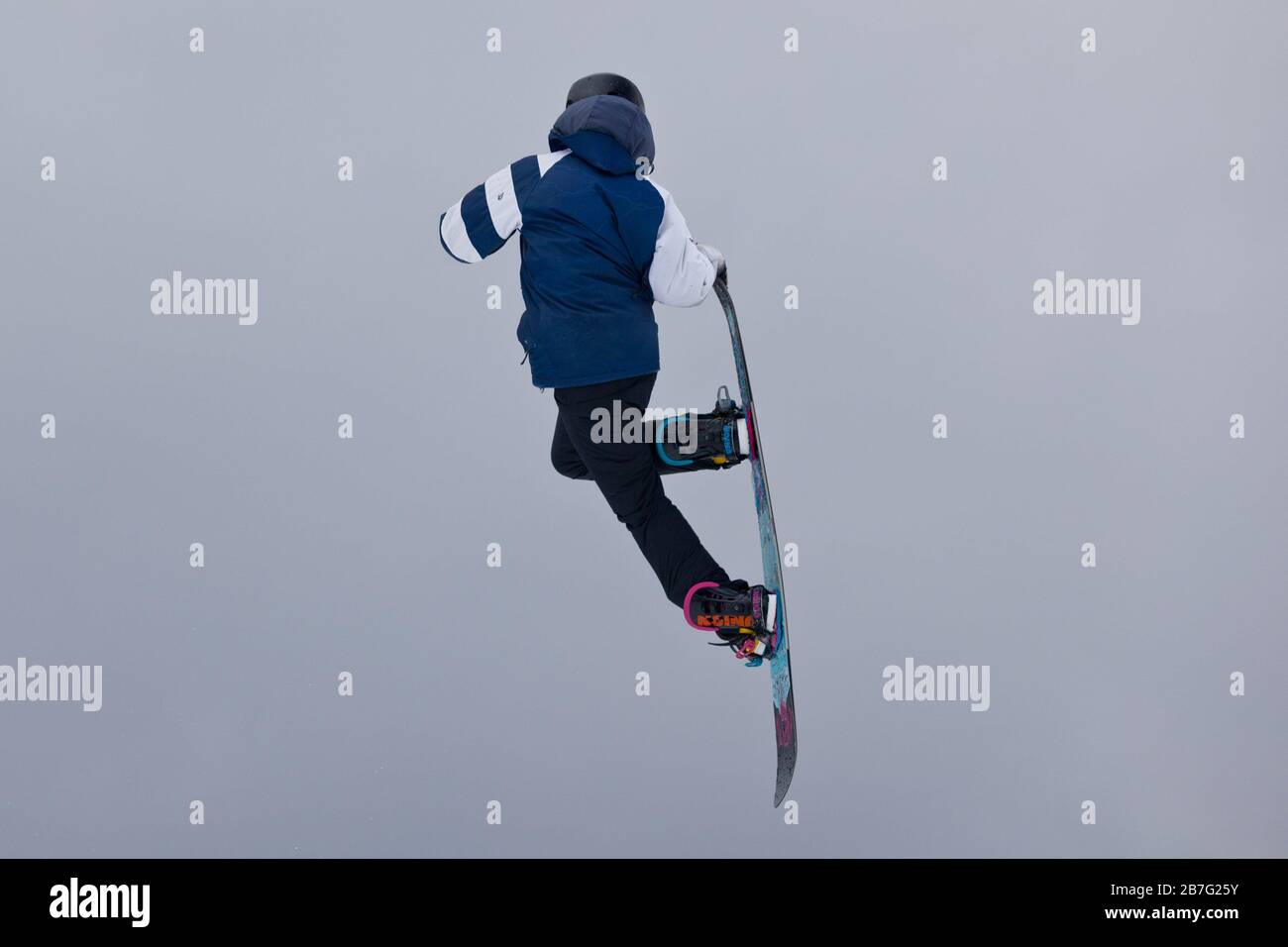 Snowboarder doing stunts in the air at Wisp Resort in Maryland Stock ...