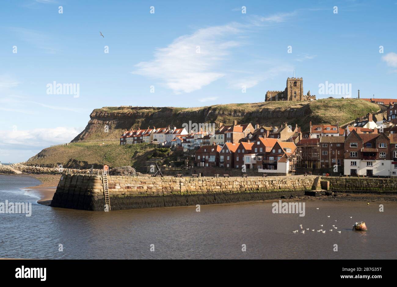 The historic Tate Hill Pier and St Marys Church in Whitby, North ...