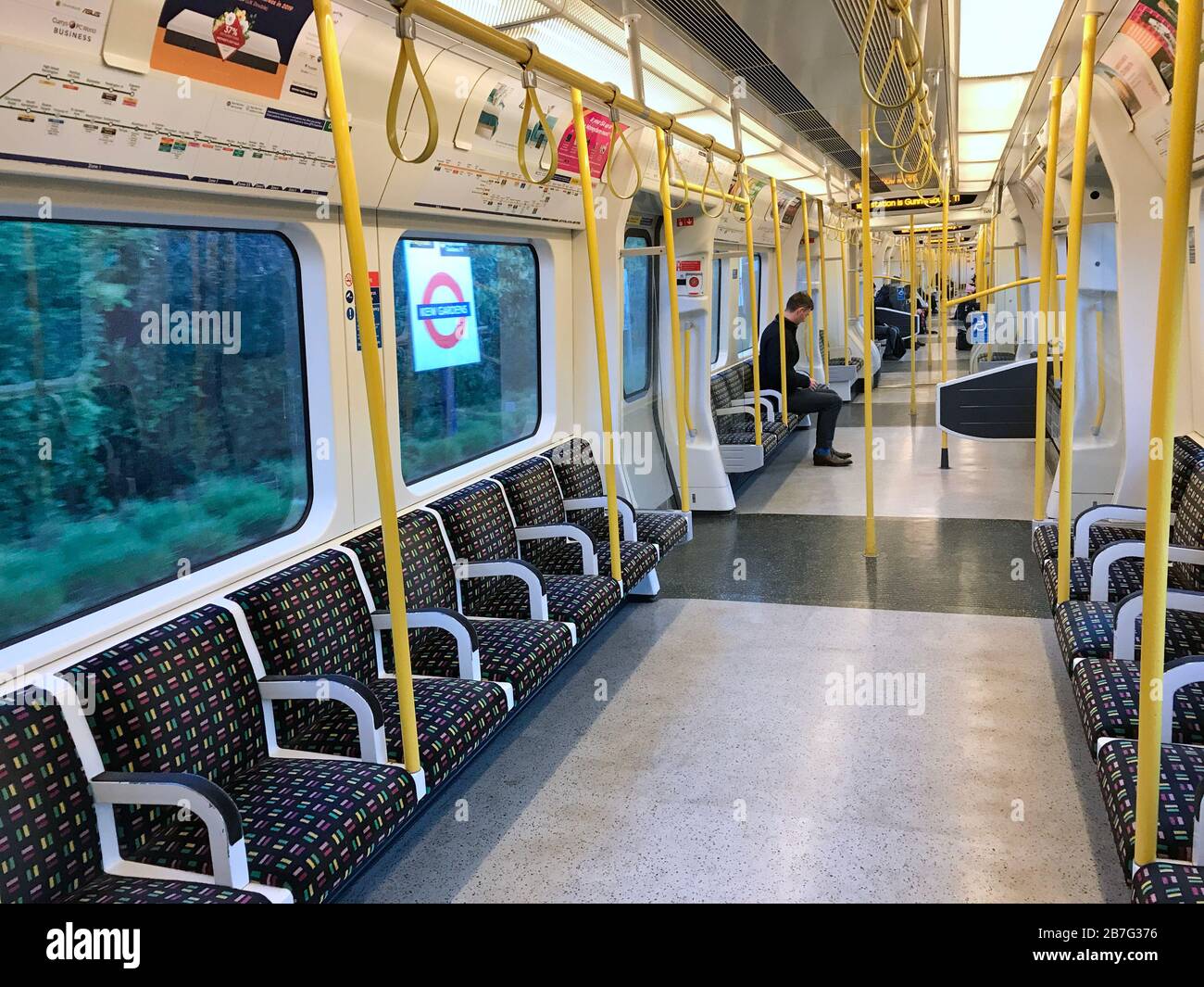 A sparsely-filled District Line carriage on an Underground train in ...