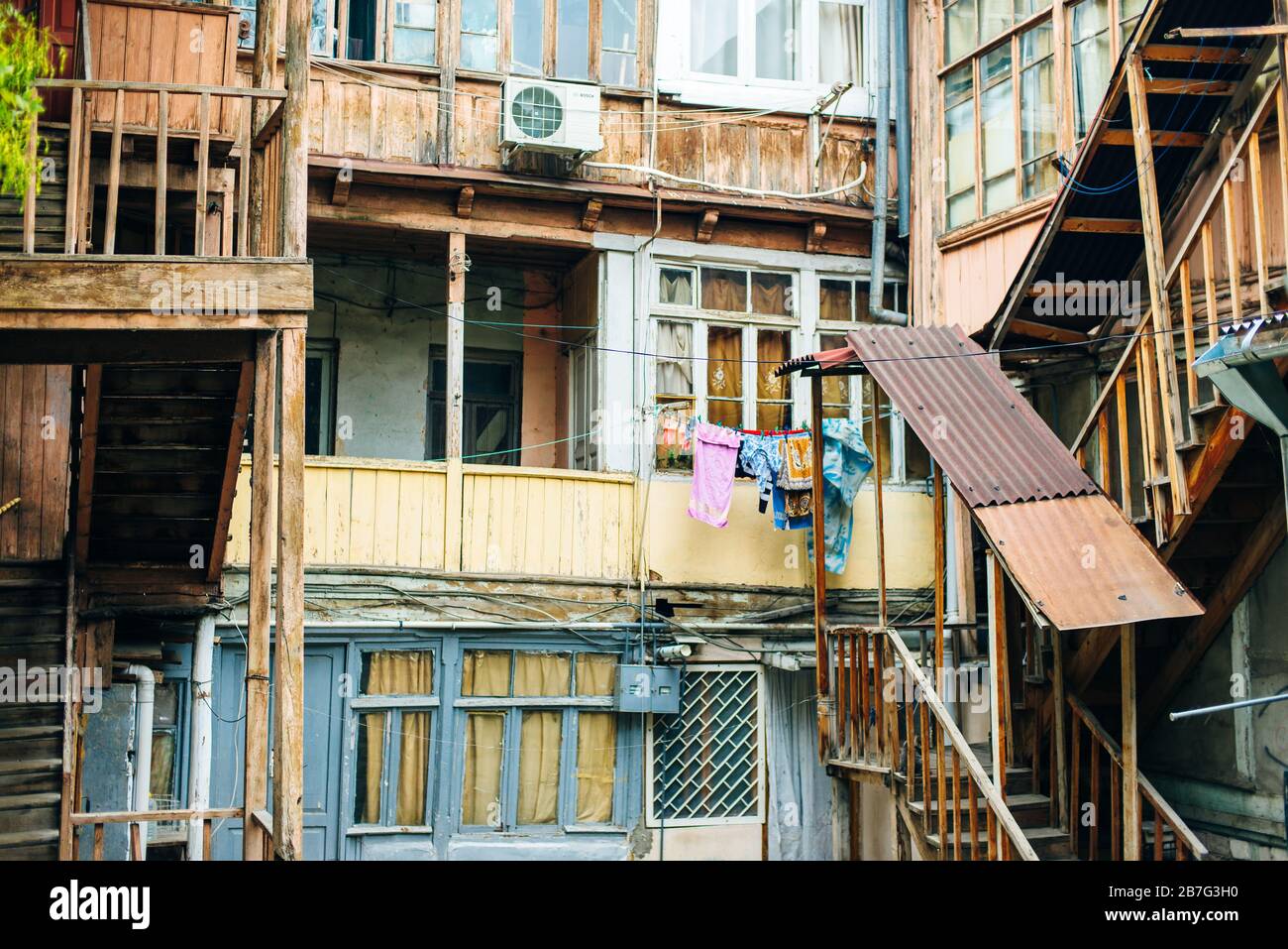 Traditional carved balconies and colorful wooden houses in the Old Town ...