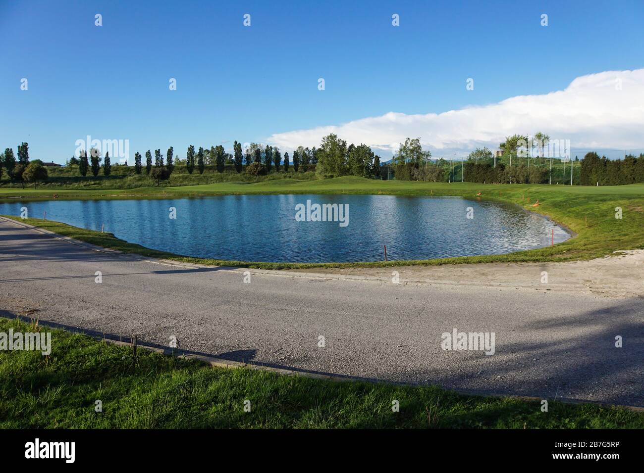 Golf course, lake, sky and green grass Stock Photo - Alamy