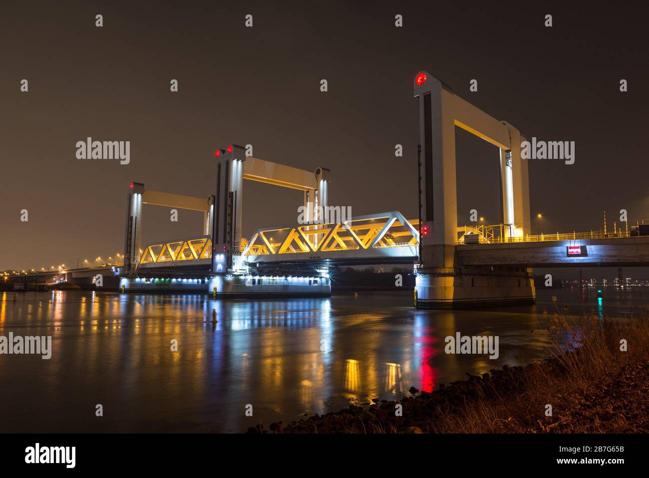 Botlek bridge at night. Modern vertical lift bridge over "Old Meuse ...