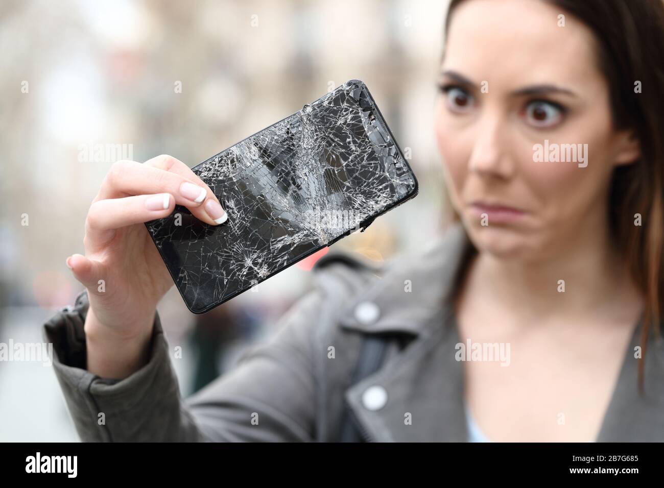 Girl Broken Cell Phone High Resolution Stock Photography and Images - Alamy
