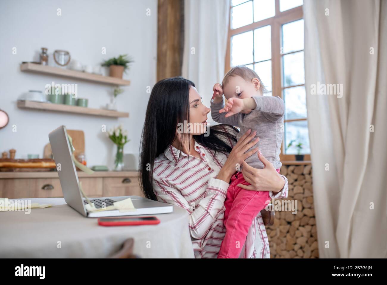 Distracted baby hi-res stock photography and images - Alamy