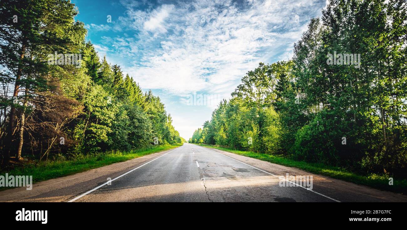 Summer road. Highway move forward direction background Stock Photo - Alamy