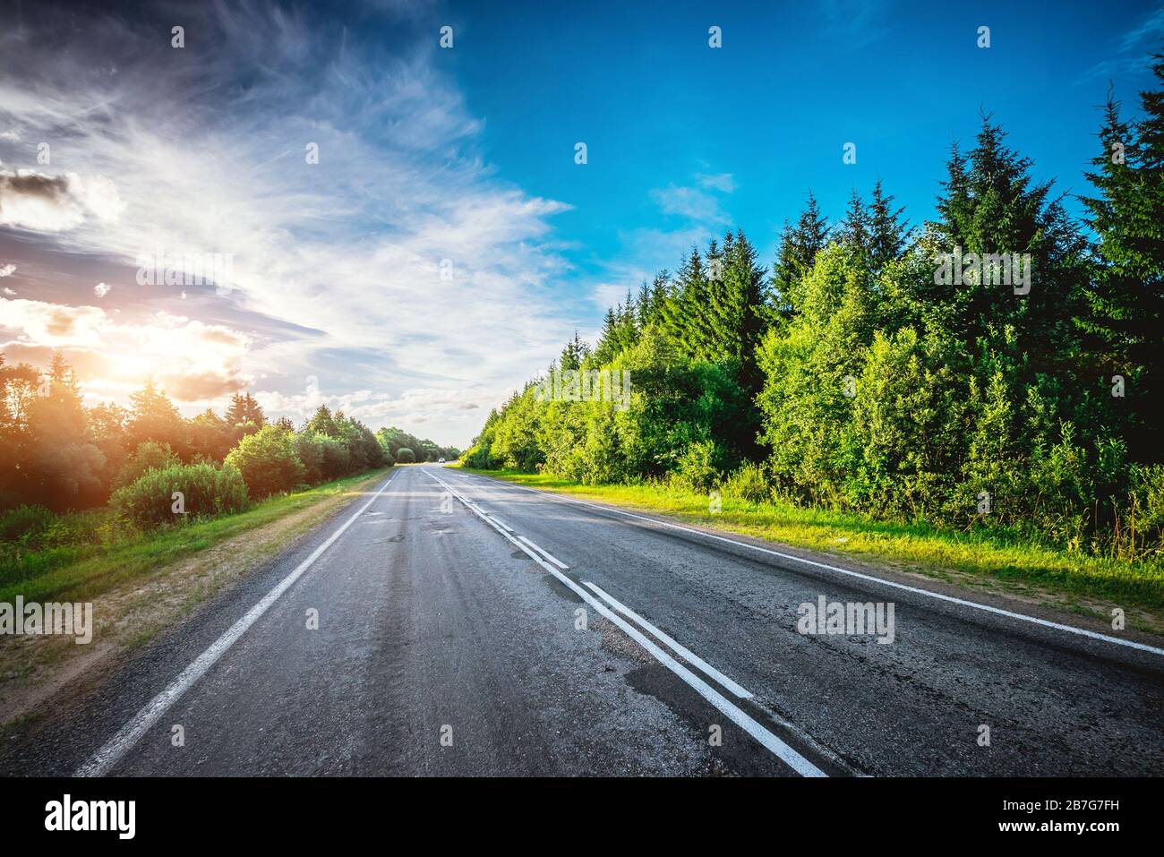 Road way forward direction. Summer morning landscape Stock Photo - Alamy